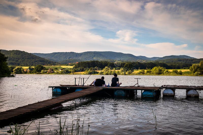 Fishermans on a Primitive Dock by the Lake Editorial Stock Image ...