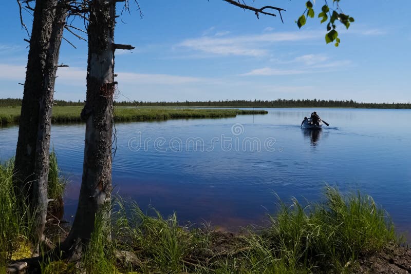 Fishermen on Boat Approach To the Shore. Fishermen in Ugra Stock Photo ...