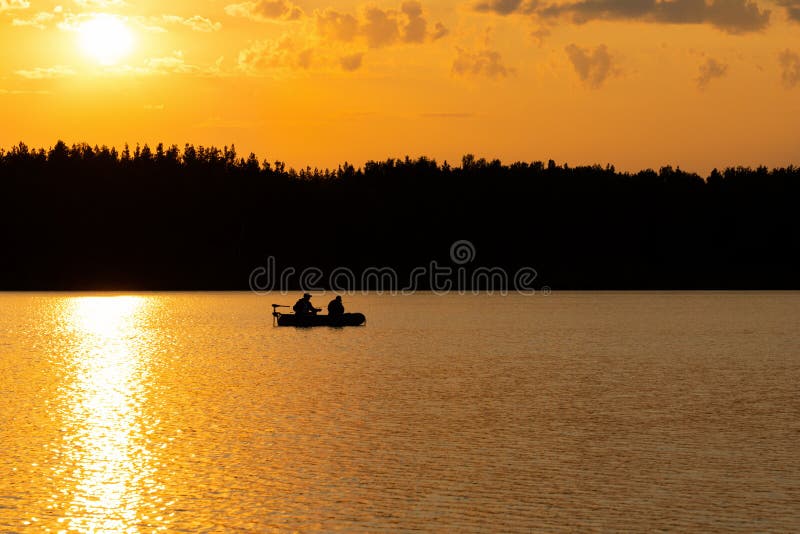 Fishermen Catch Fish on the Lake at Sunset Stock Image - Image of ...