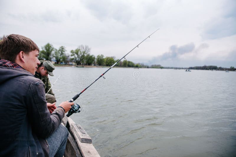 Fishermen Catch Fish Sitting in the Boat Stock Photo - Image of catches ...