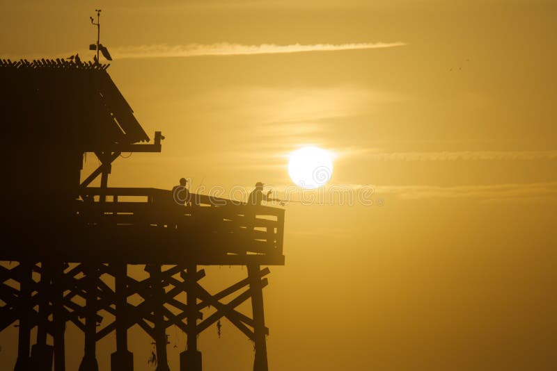 Fishermen catching the sun stock image. Image of sand - 56276661