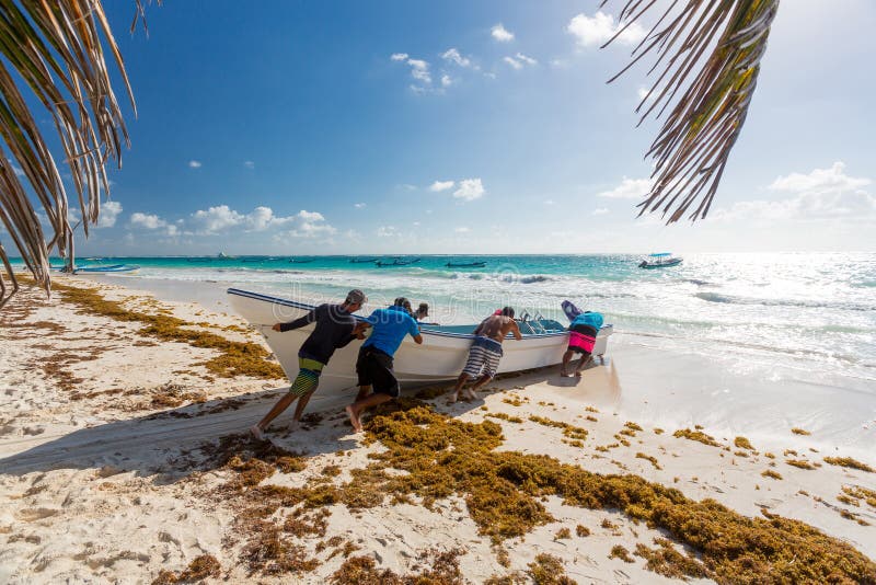 Fishermen Pushing a Bot on a Beach Editorial Photography - Image of ...