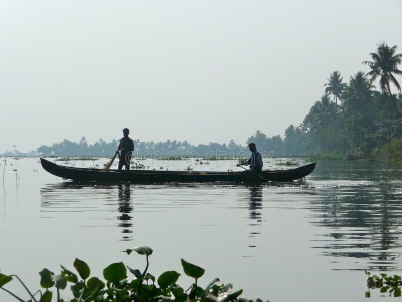 Fishermen in a small boat editorial stock photo. Image of asia - 54603138