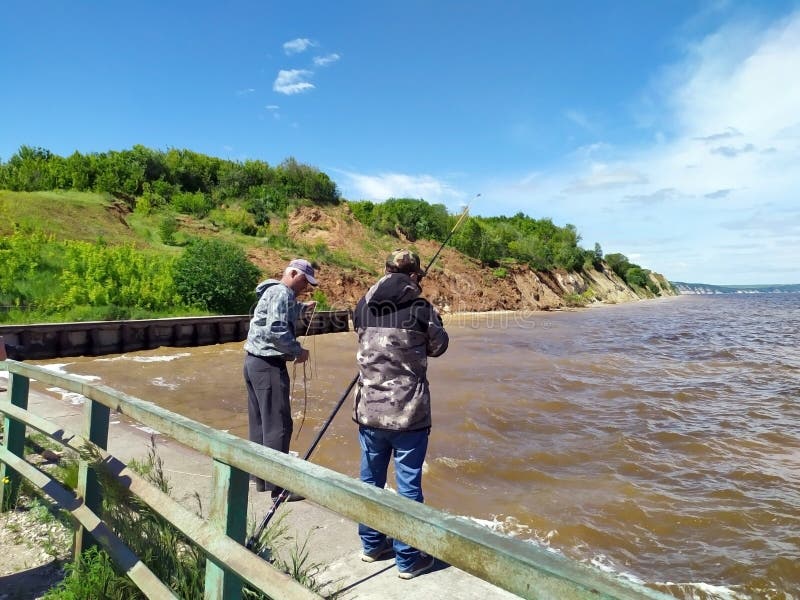 Fishermen Stand on the Shore and Fish. the Fishermen are Standing with ...