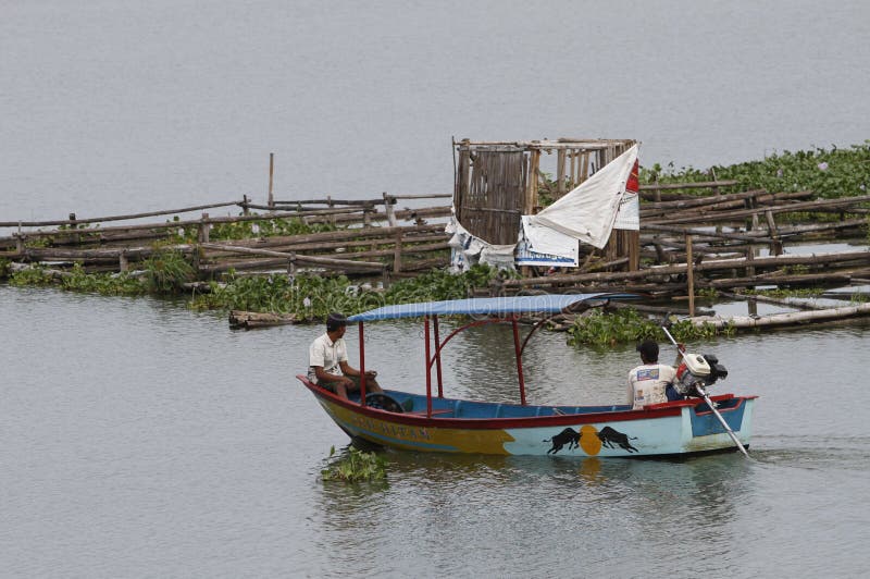 Fishermen editorial photo. Image of lake, boat, java - 36059856