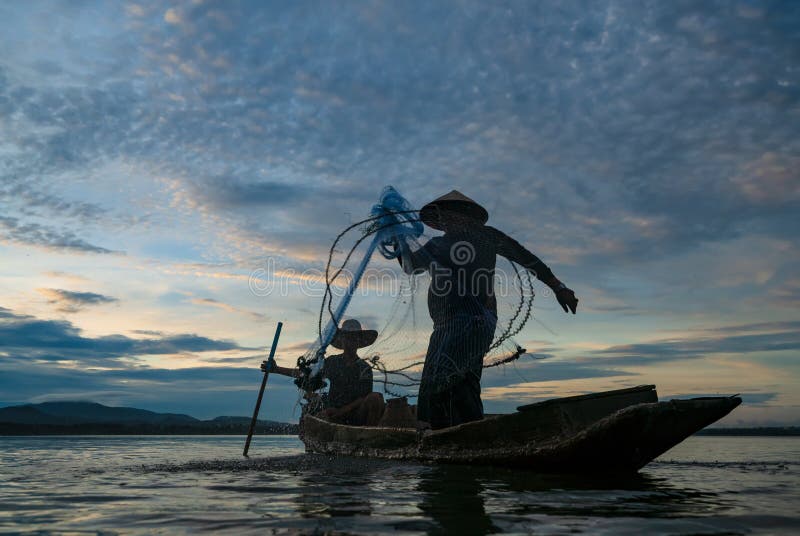 Fishermen Using Nets To Catch Fish Stock Photo - Image of sunrise ...