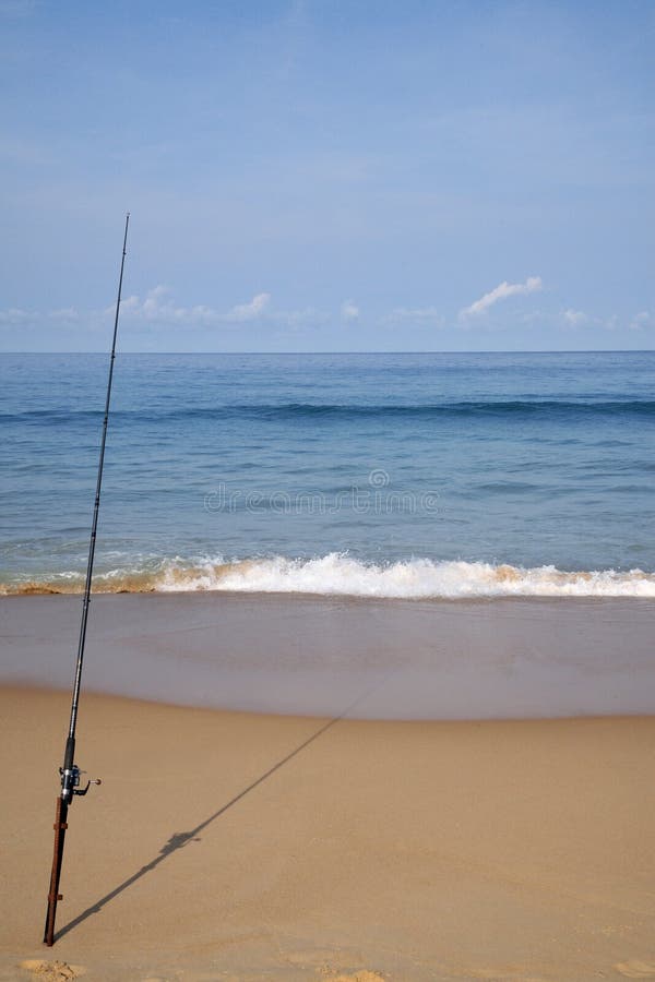 Fishing at the beach stock photo. Image of sandy, seascape - 3732316