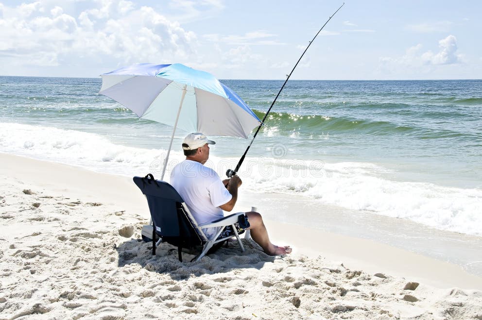 Fishing from the Beach stock image. Image of male, umbrella - 6504133