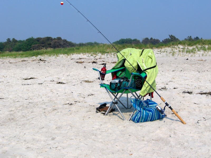 Fishing on the beach. stock image. Image of ocean, pole - 53871101