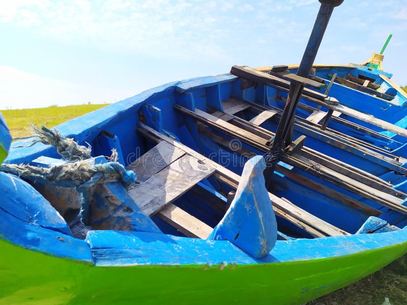 Fishing Boat on the Edge of the Lake with Blue Sky Stock Image - Image ...