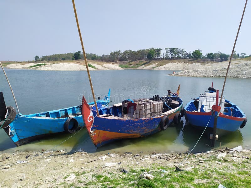 Fishing Boat on the Edge of the Lake with Blue Sky Editorial Stock ...