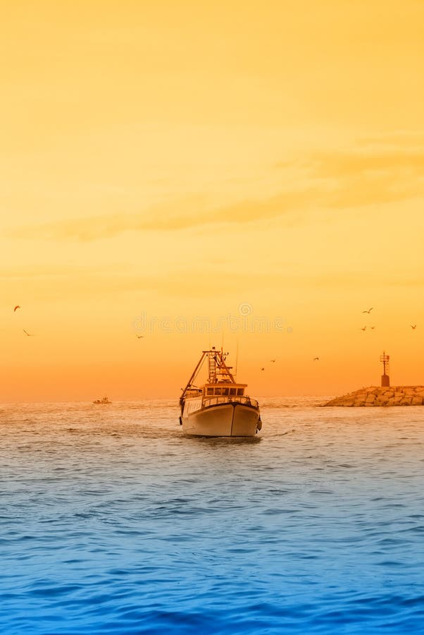 Fishing Boat Entering the Port Stock Photo - Image of orange, scene ...