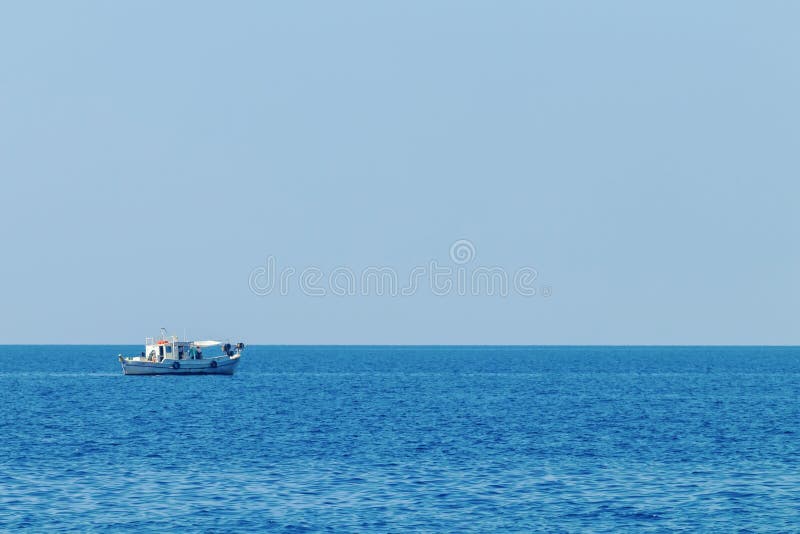 Fishing Boat Floating on the Water, Blue Sea and Sky Stock Photo ...