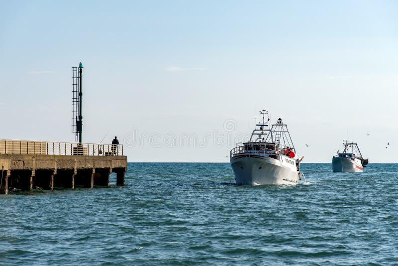 Fishing boat at the harbor stock photo. Image of harbor - 73856862