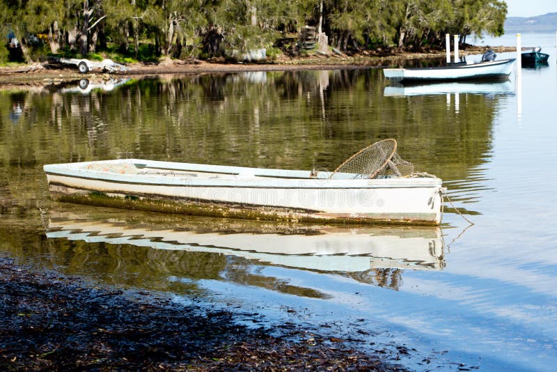 Fishing Boat on Lake with Reflection in Water Stock Image - Image of ...