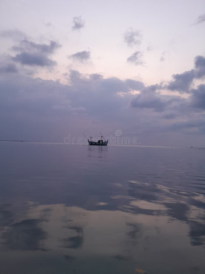 Fishing Boat in the Middle of Calm Sea Stock Photo - Image of boat ...