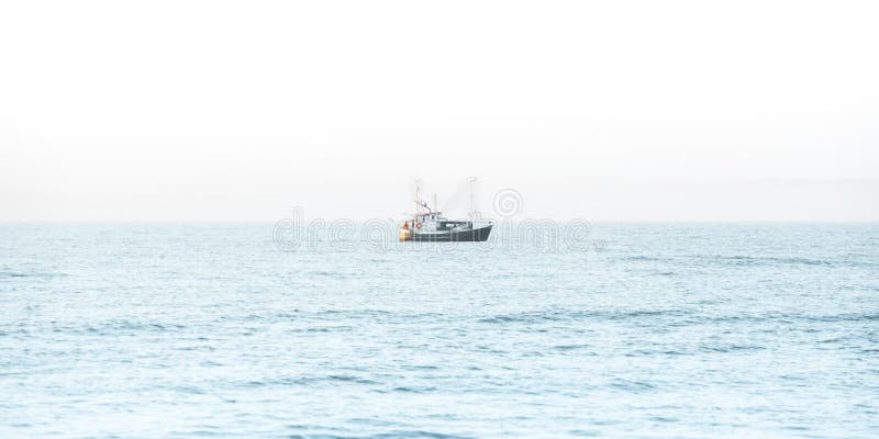 Fishing Boat in the Middle of the Sea Stock Photo - Image of boats ...