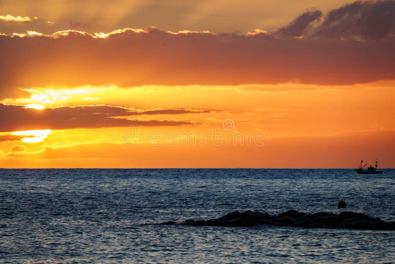 Fishing Boat in the Ocean Horizon at Sunset Stock Photo - Image of ...