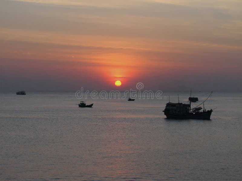 Fishing Boat in the Ocean at Sunset Stock Photo - Image of blue ...