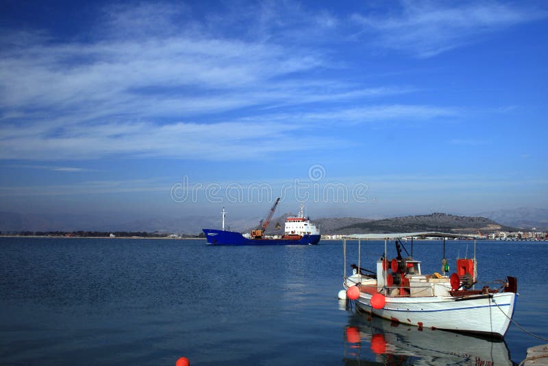 Fishing Boat and Old Cargo Ship - Greece Stock Image - Image of ...