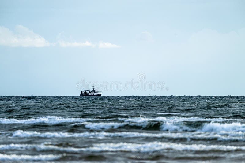 Fishing Boat on the Open Sea Under a Clear Sky.. Stock Photo - Image of ...