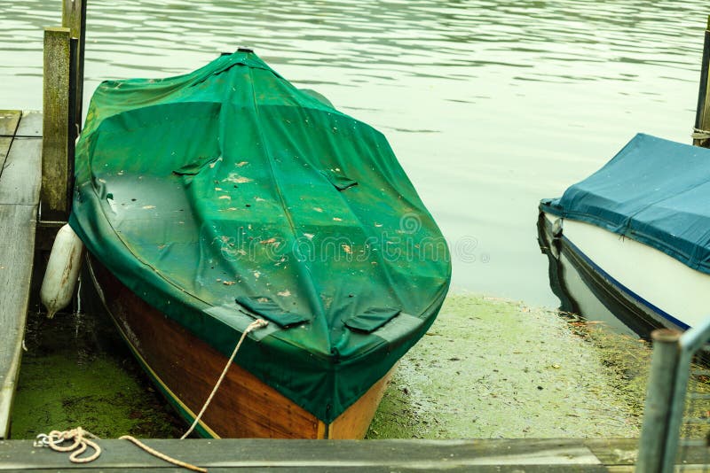 Fishing Boat Rowboat Moored and Floating at Coast. Stock Photo - Image ...