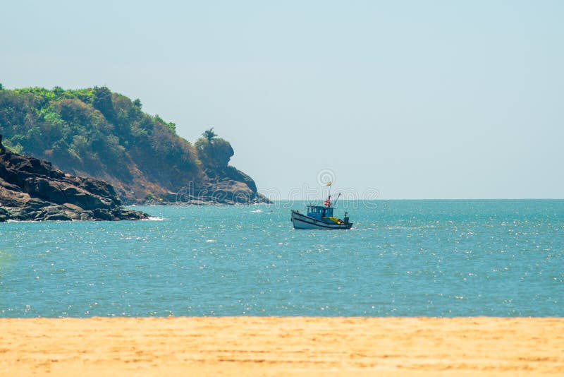 Fishing Boat Sailing Away into the Distance of the Ocean Stock Image ...
