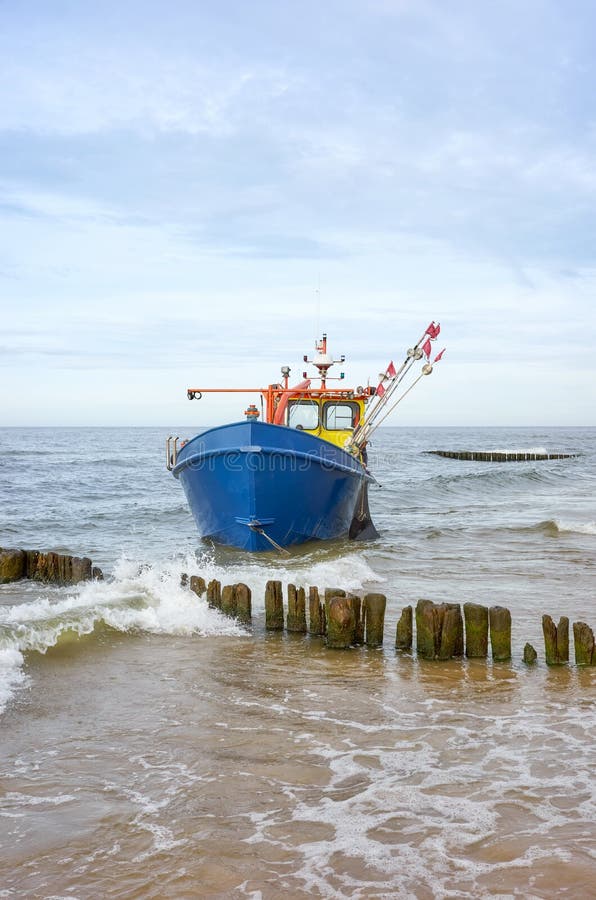 Fishing Boat Stranded on a Beach Stock Image - Image of stranded, beach ...