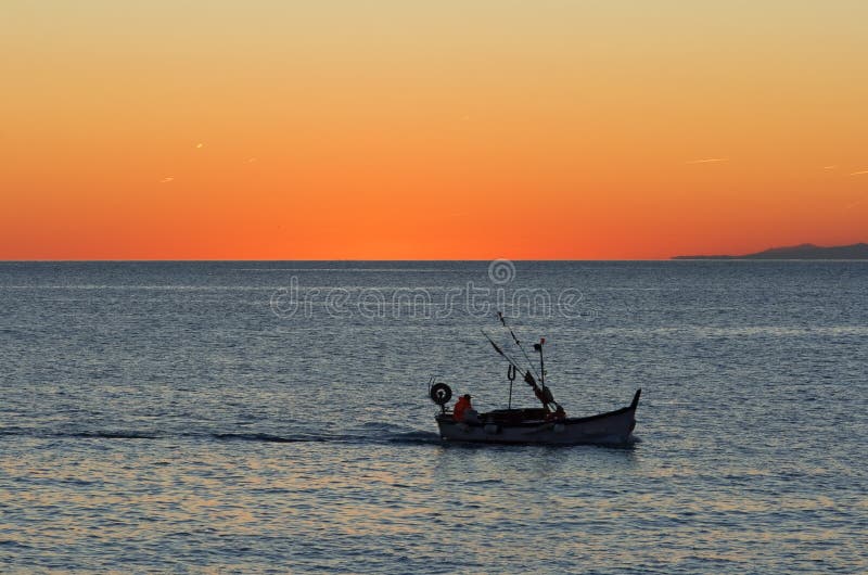 Fishing boat at the sunset stock photo. Image of person - 11194528