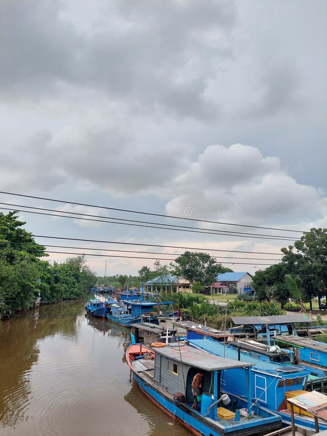 Fishing boat in a village editorial photo. Image of electricity - 266190791