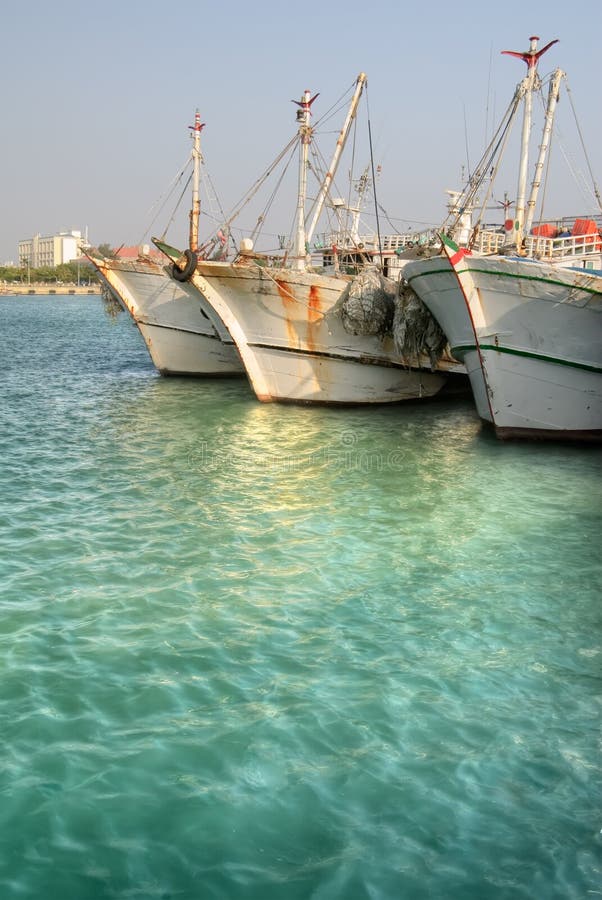 Fishing boats in harbor stock image. Image of color, seaport - 16373395