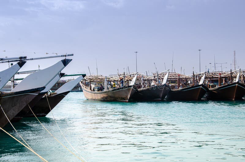 Fishing boats in a harbor stock photo. Image of culture - 337741724