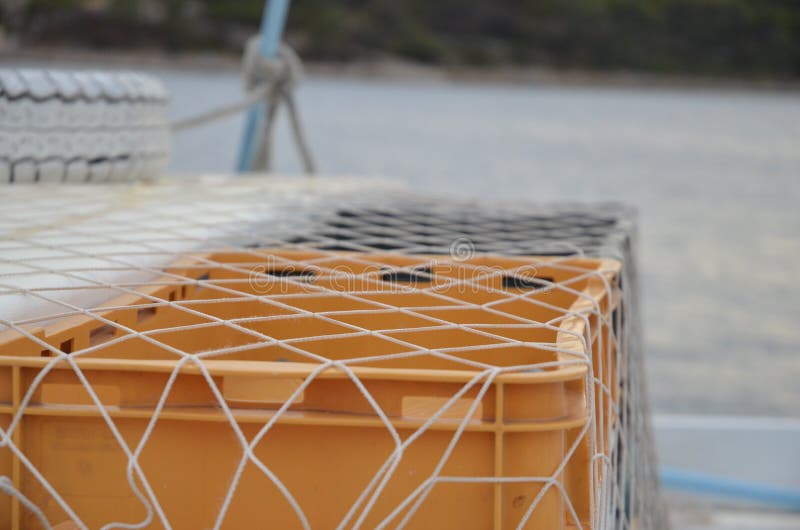 Fishing Cassettes Secured with a Net Stock Photo - Image of roof, iron ...