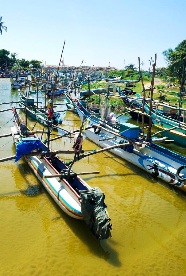 Fishing Catamarans in the River Channel. Fishing Village Stock Photo ...