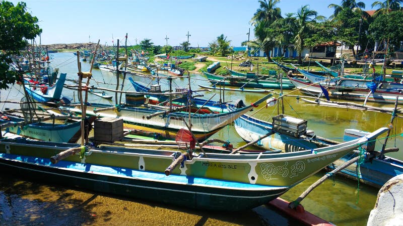 Fishing Catamarans in the River Channel. Fishing Village Stock Image ...