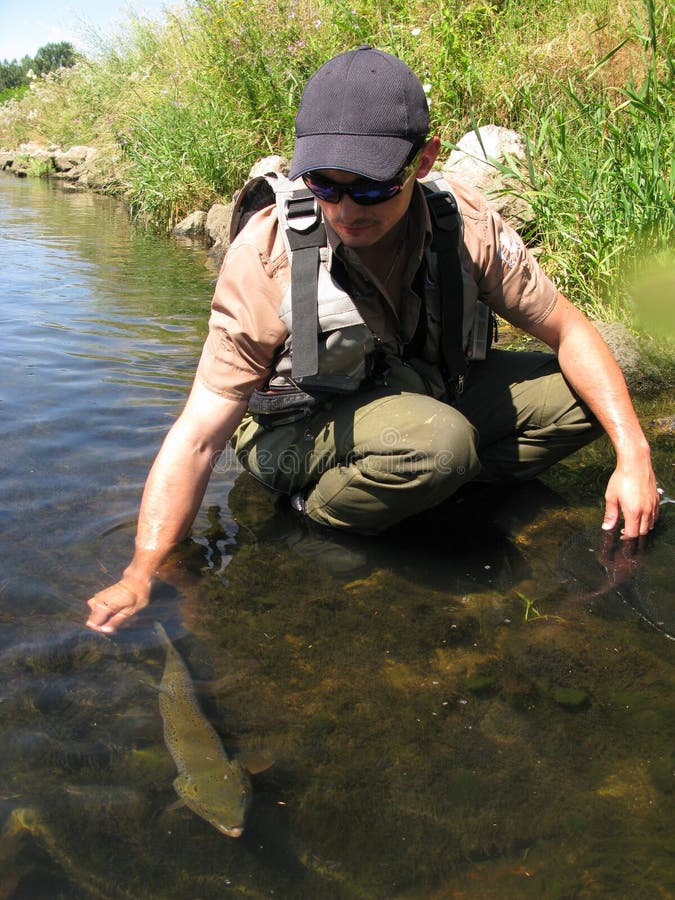 Fishing catch and release stock photo. Image of boat - 32934142