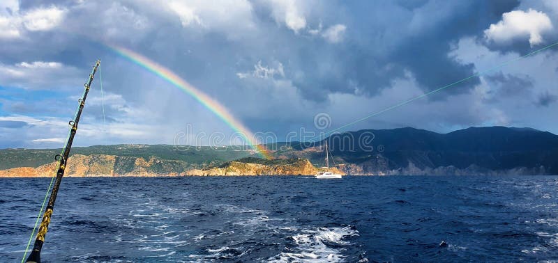 Fishing, Clouds, Storm in the Ocen and Rainbow in the Sky Stock Image ...