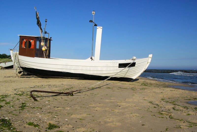 Fishing Cutter on the Beach Stock Photo - Image of shore, blue: 12384866
