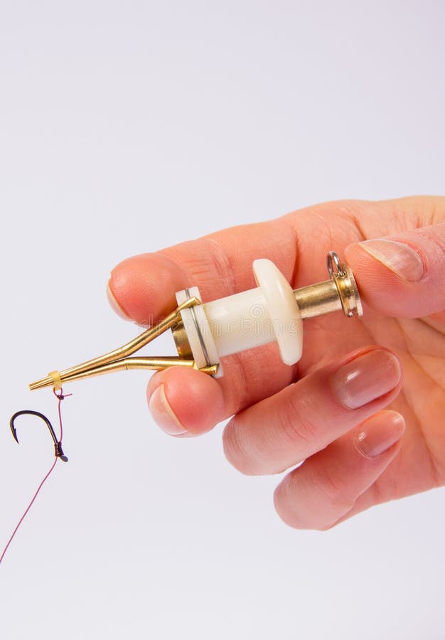 Fishing Device for Putting on the Bait. New in the Method Feeder. Stock ...
