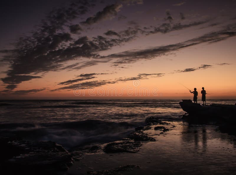 Fishing at Dusk, The image captures a couple fishing on the beaches of
