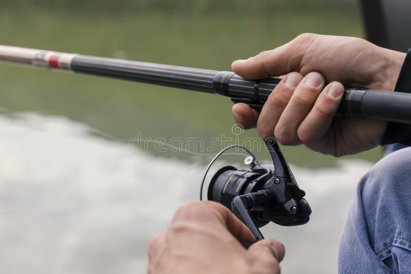 Fishing Fish from Shore with a Stick Stock Photo - Image of river ...