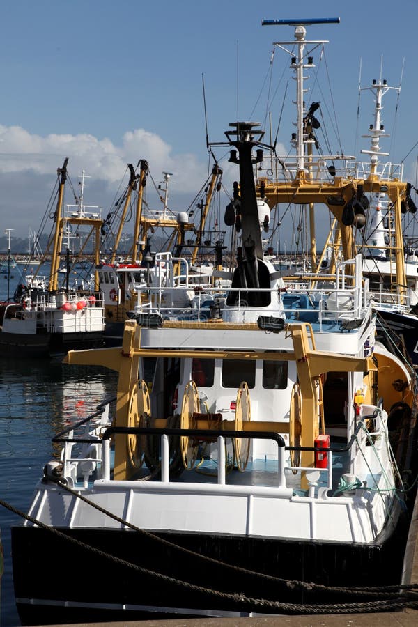 Fishing fleet in harbour stock image. Image of industry - 15915577