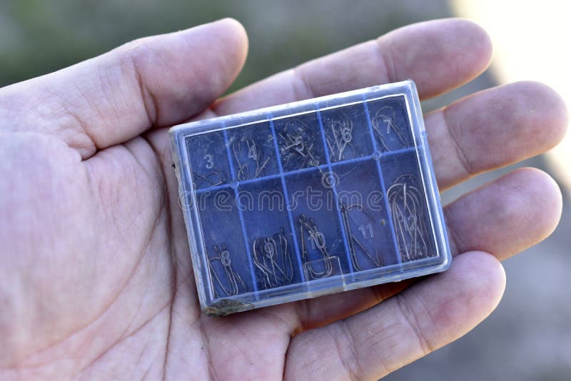 Fishing Hooks in a Box in Your Hand Stock Image - Image of fish, hook ...