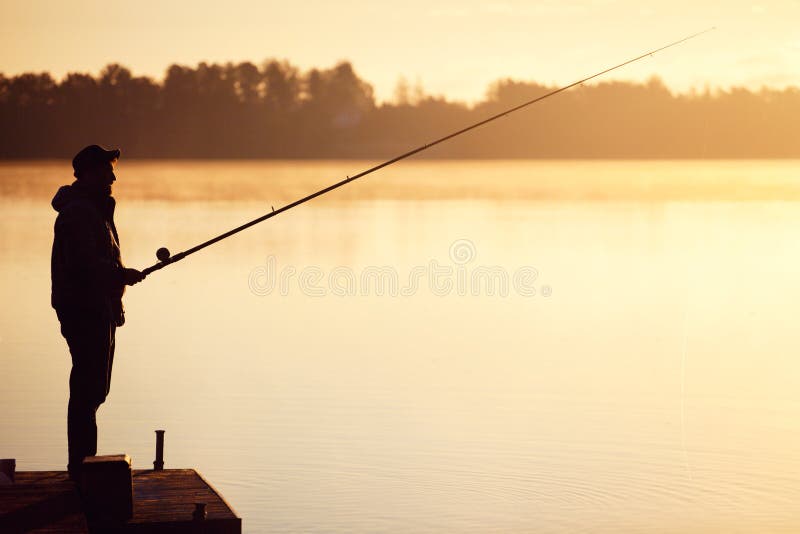 Fishing on morning lake stock image. Image of person - 77304567