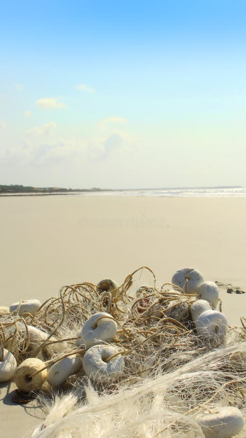 Fishing net by the beach stock image. Image of fishing - 61379469