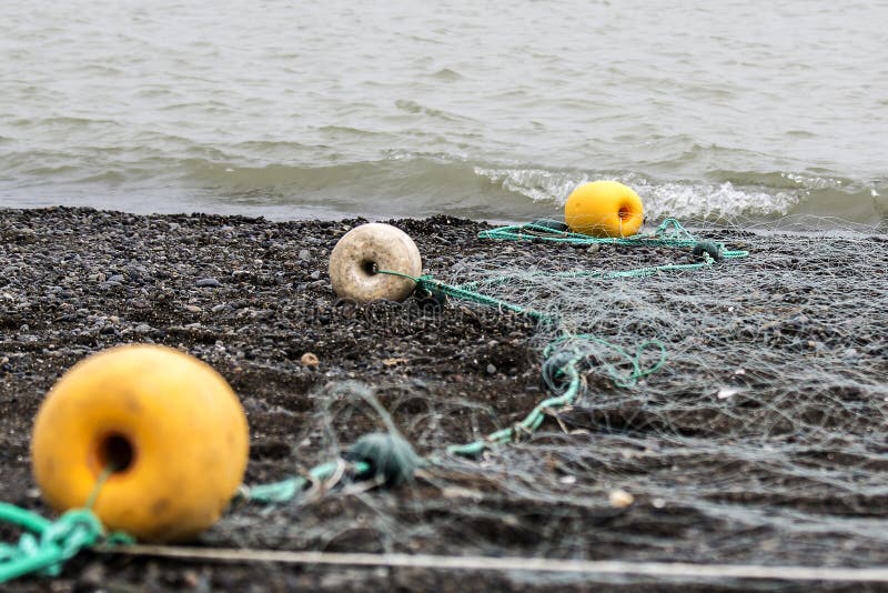 Fishing Net on a Black Shore Stock Photo - Image of beach, seine: 79899736