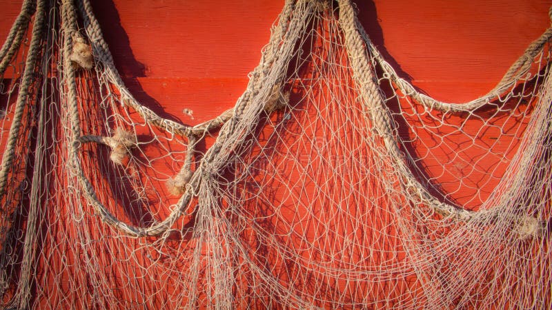 Fishing Net Hanging on Red Wall Stock Photo - Image of nets, closeup ...