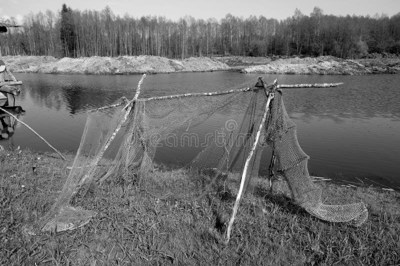 Fishing Net on Lake Shore in Black and White Style Stock Image - Image ...