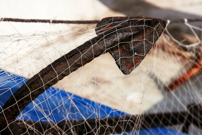 Fishing net and the anchor stock photo. Image of closeup - 101682316