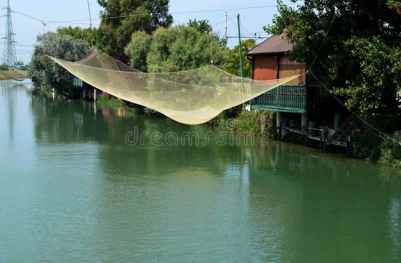 Fishing net on the river stock image. Image of tree - 121864751